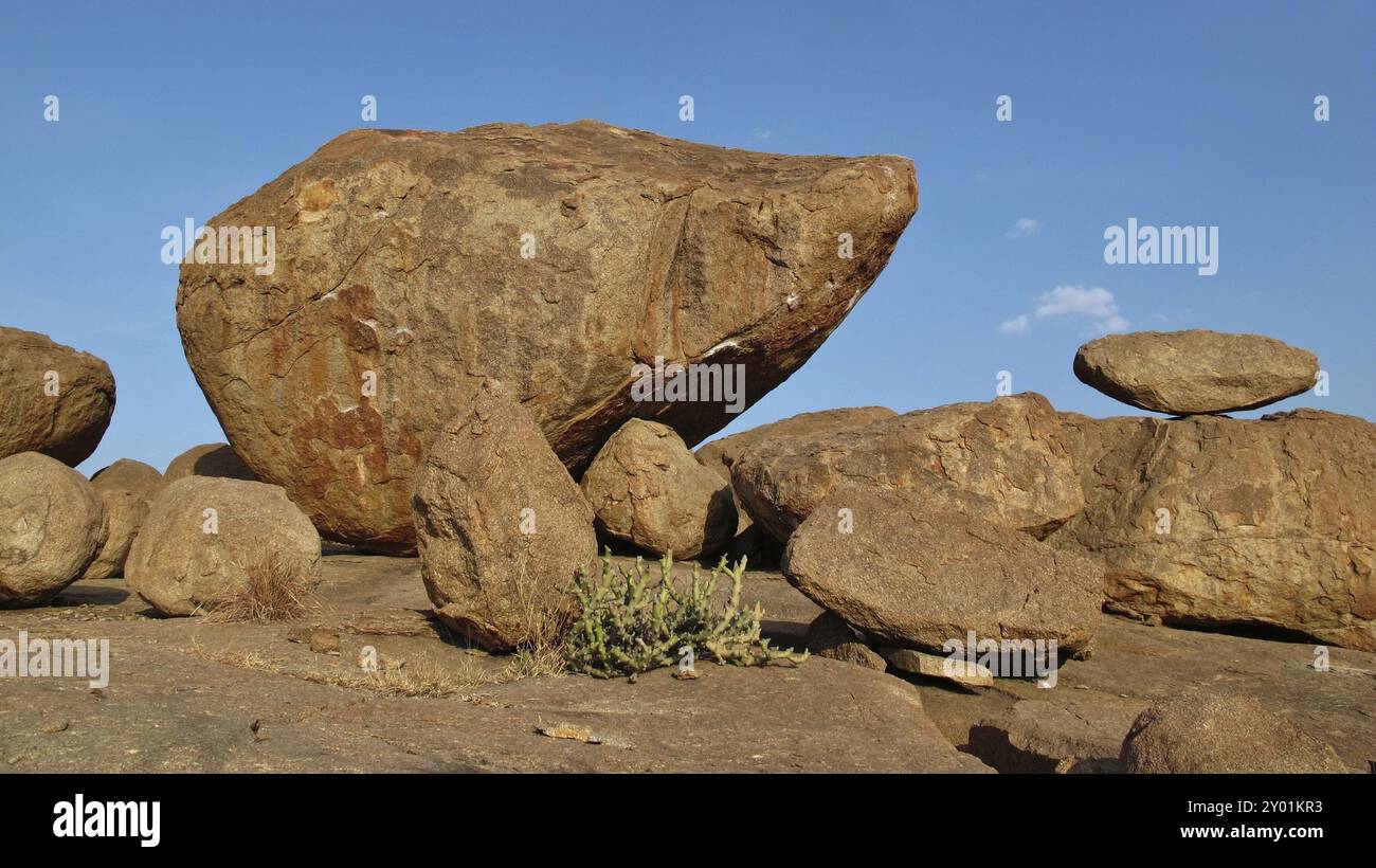 Big granite boulder and smaler balancing granite boulder on the left ...