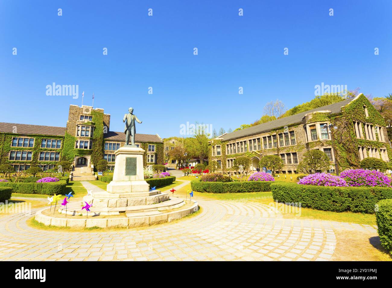 Ivy covered brick buildings surround the quad with Horace Grant ...