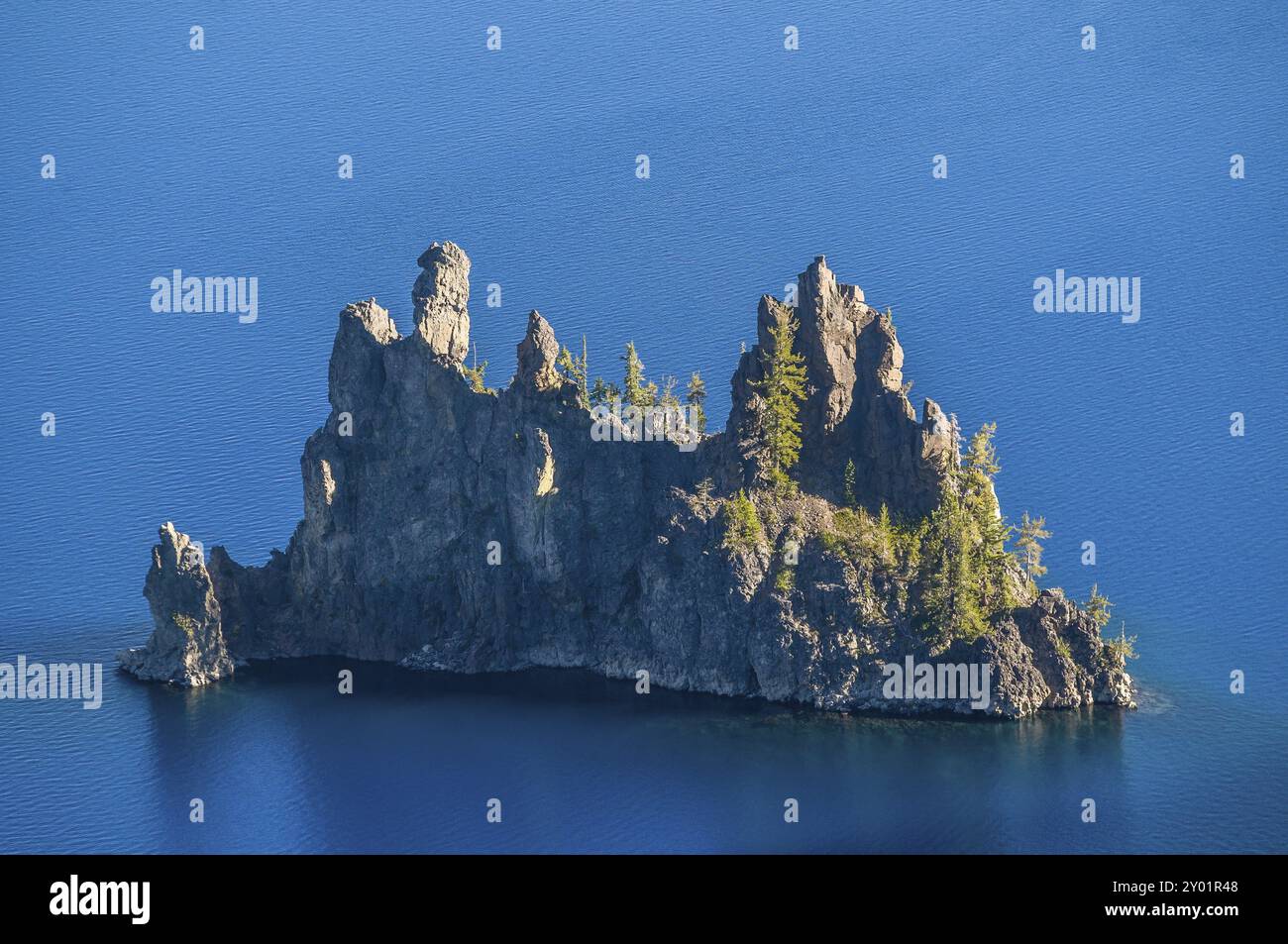 The Phantom Ship rock formation in the deep blue crater lake of Mount ...