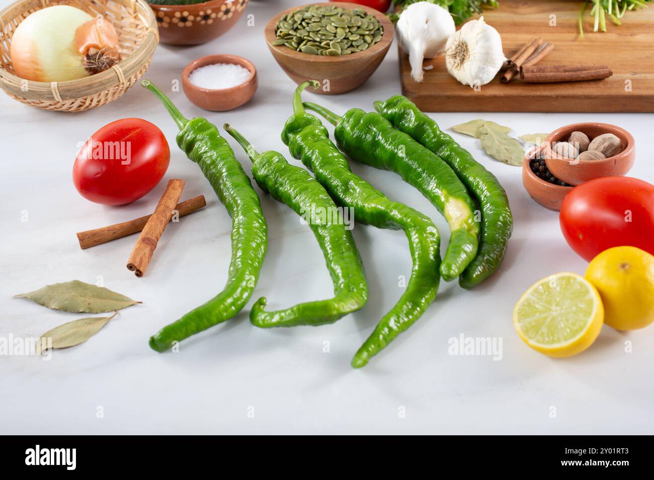 A view of a row of several green Italian long hot chili peppers Stock ...