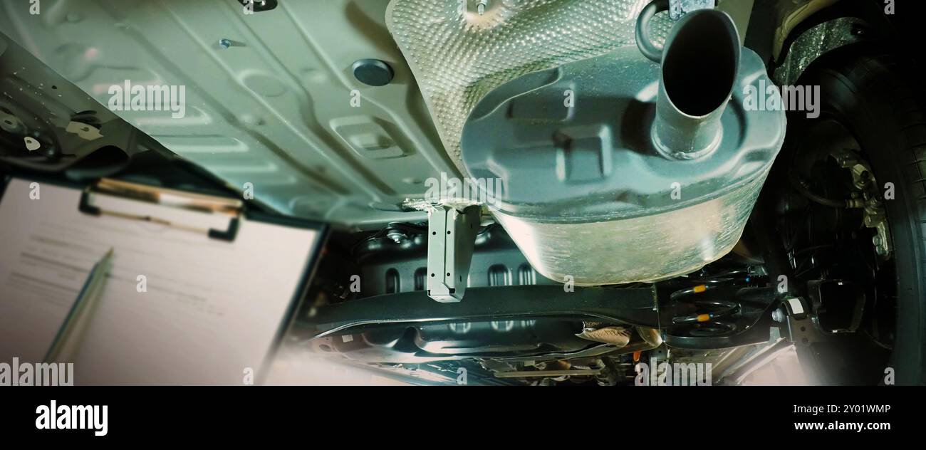 Under car exhaust pipe and suspension. Automotive mufflers. Inspection ...