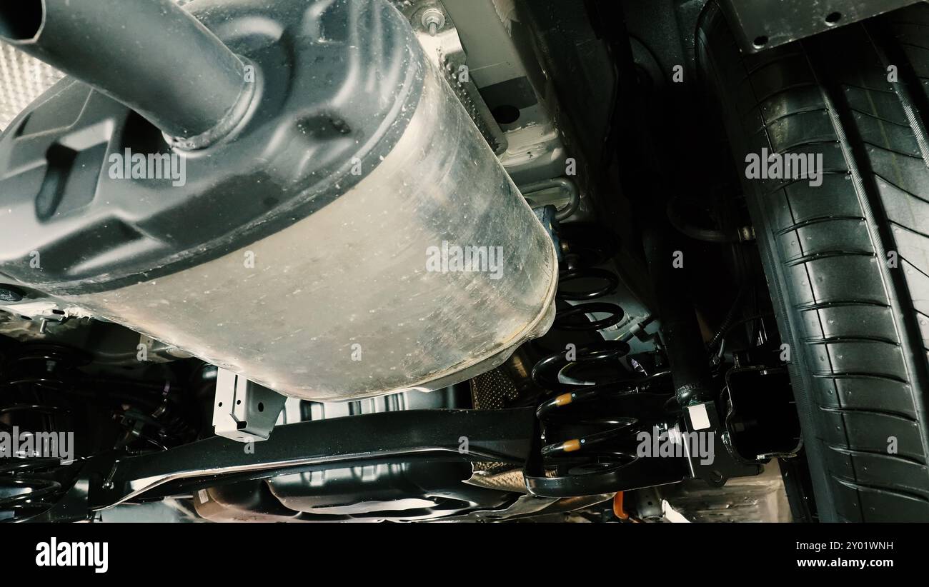 Under car exhaust pipe and suspension. Automotive mufflers. Inspection ...