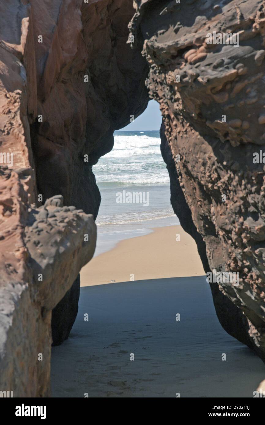 Rock passage to the sea & beach Stock Photo - Alamy
