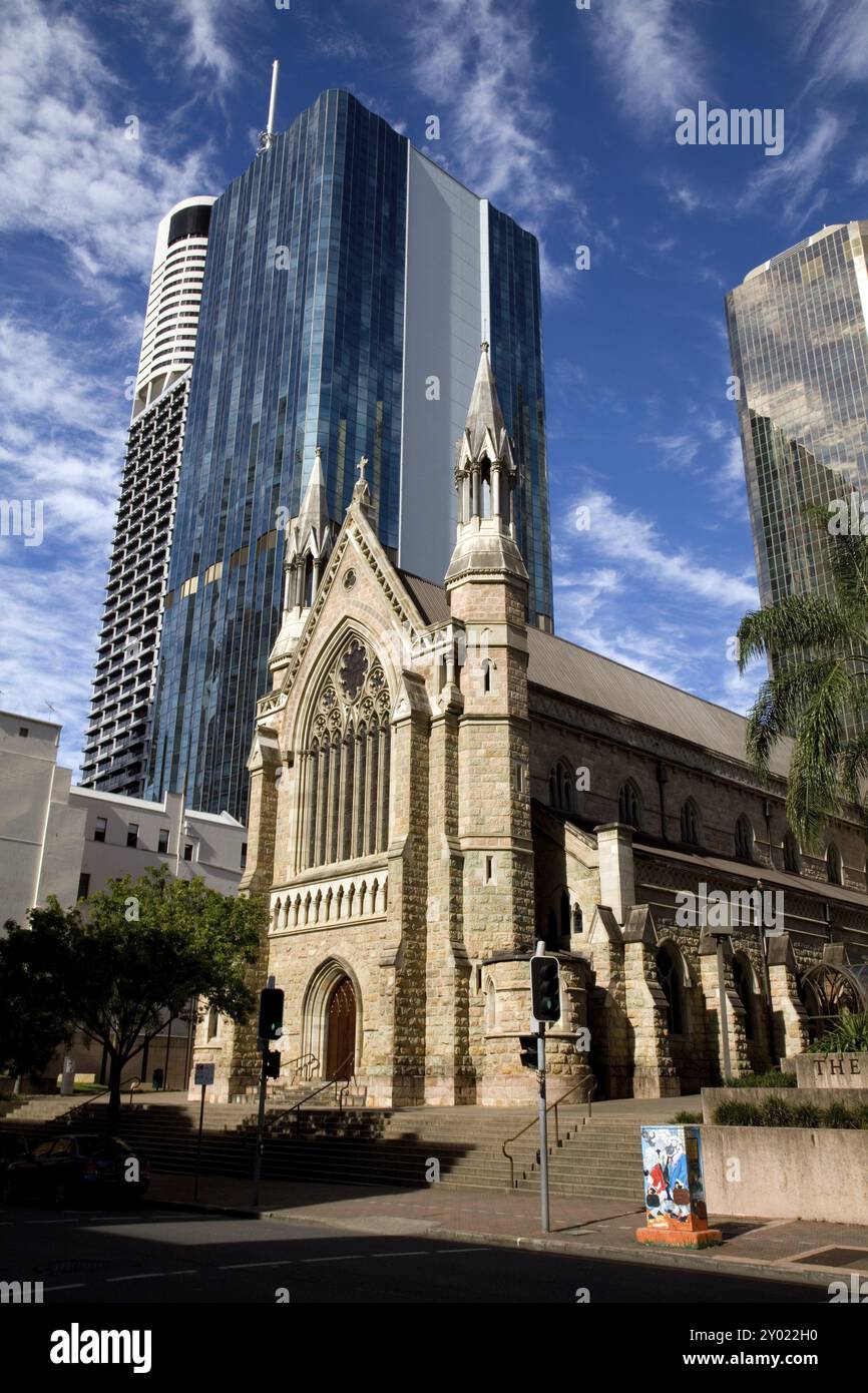 The oldest church in the city of Brisbane surrounded by skyscrapers ...
