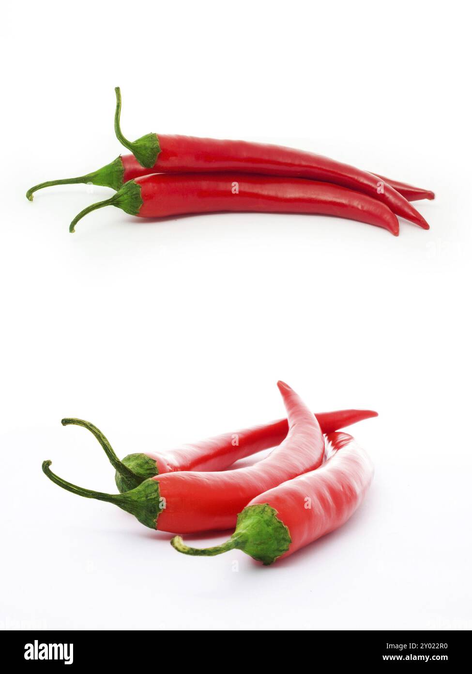 Three red peppers isolated on white Stock Photo - Alamy