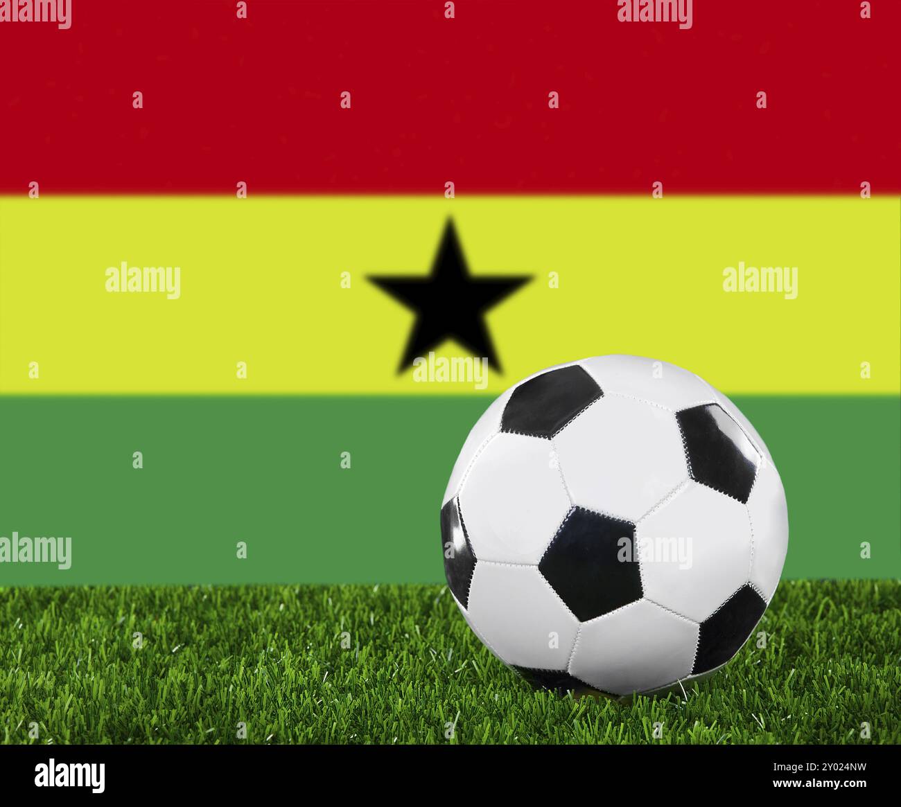 The Ghana flag and soccer ball on the green grass Stock Photo - Alamy