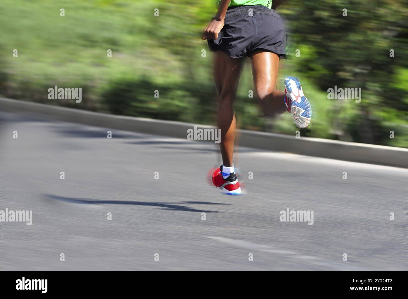 Marathon Racer running with motion blur Stock Photo - Alamy