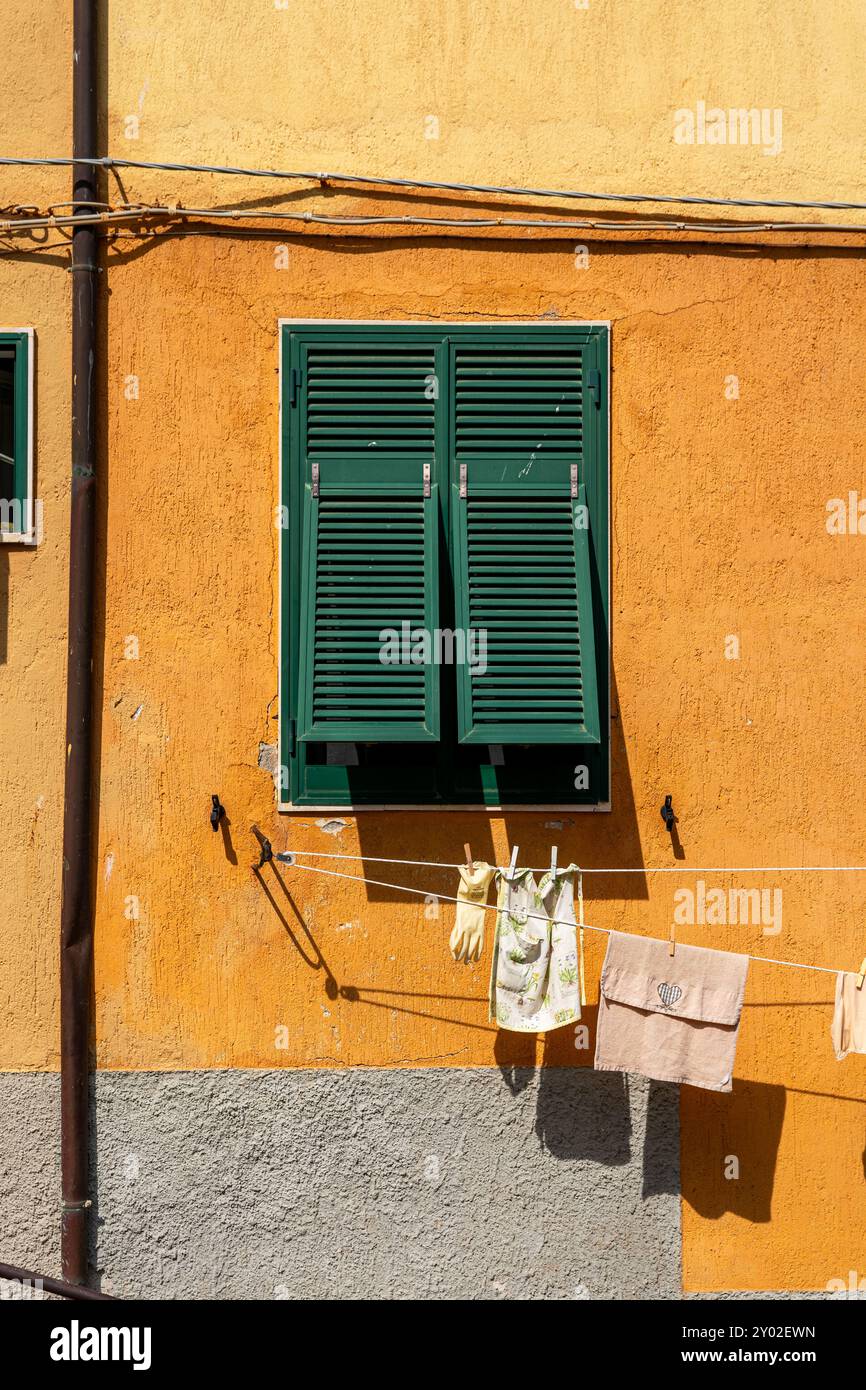 Picturesque window of a house, with laundry hung to clothesline to dye ...