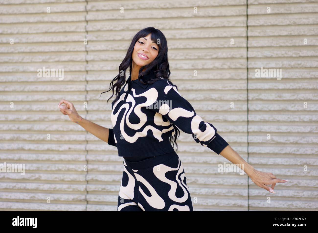 Passionate dancer smiling at camera while performing in the city Stock ...