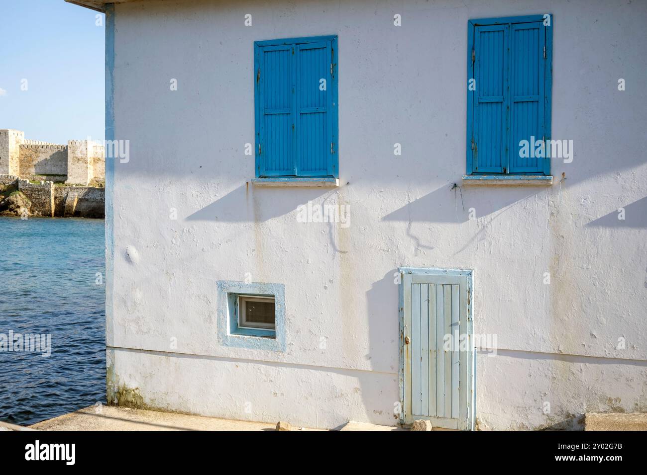 Greek style island with wooden blue windows and sea view Stock Photo ...
