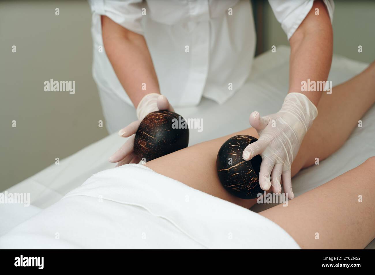 Relaxing massage therapy using wooden tools in a wellness center Stock ...