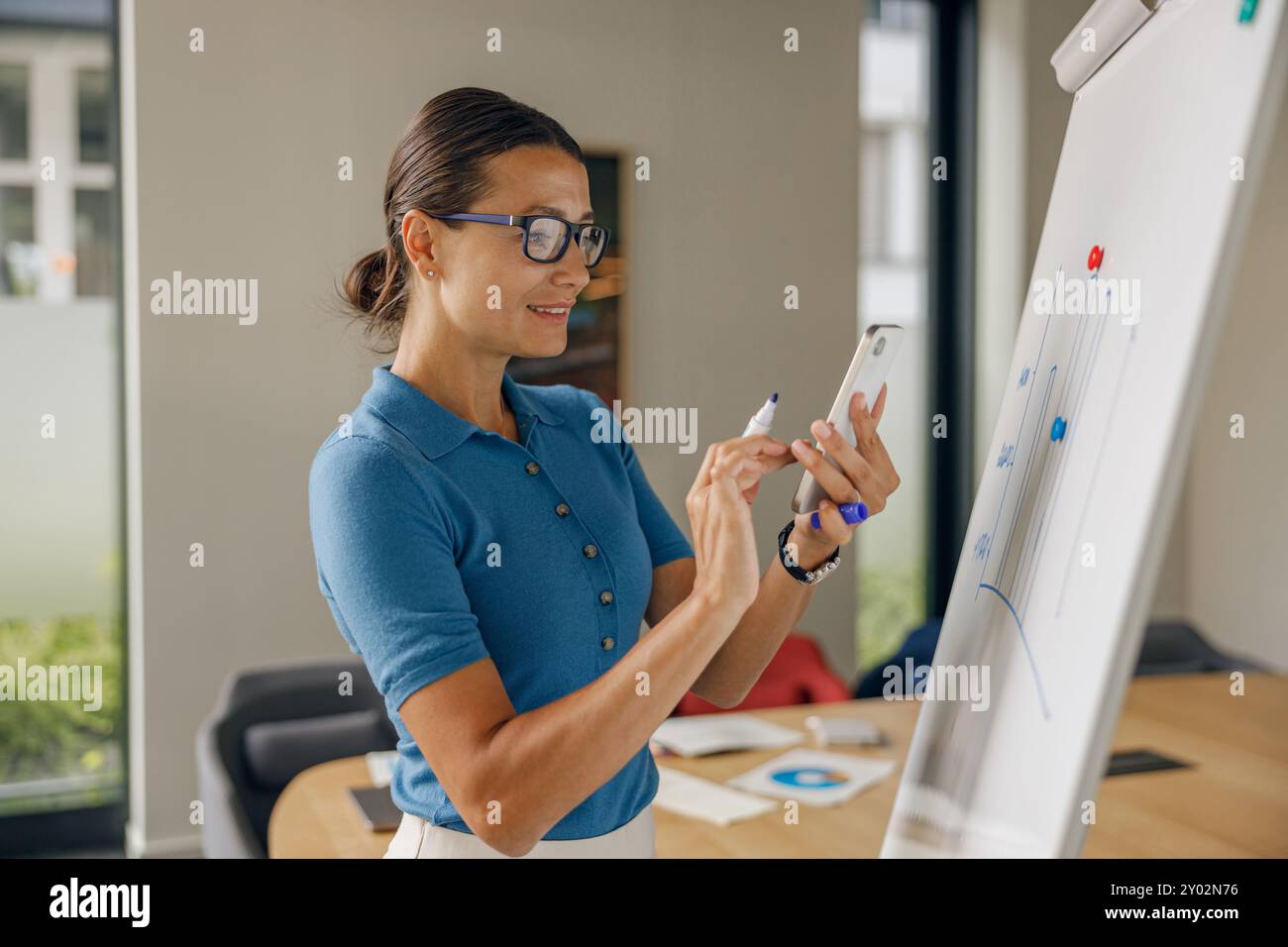 A Professional Woman Collaborating and Presenting Innovative Ideas in a ...