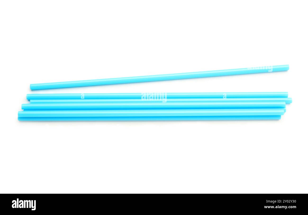 Blue plastic straws on white background Stock Photo - Alamy