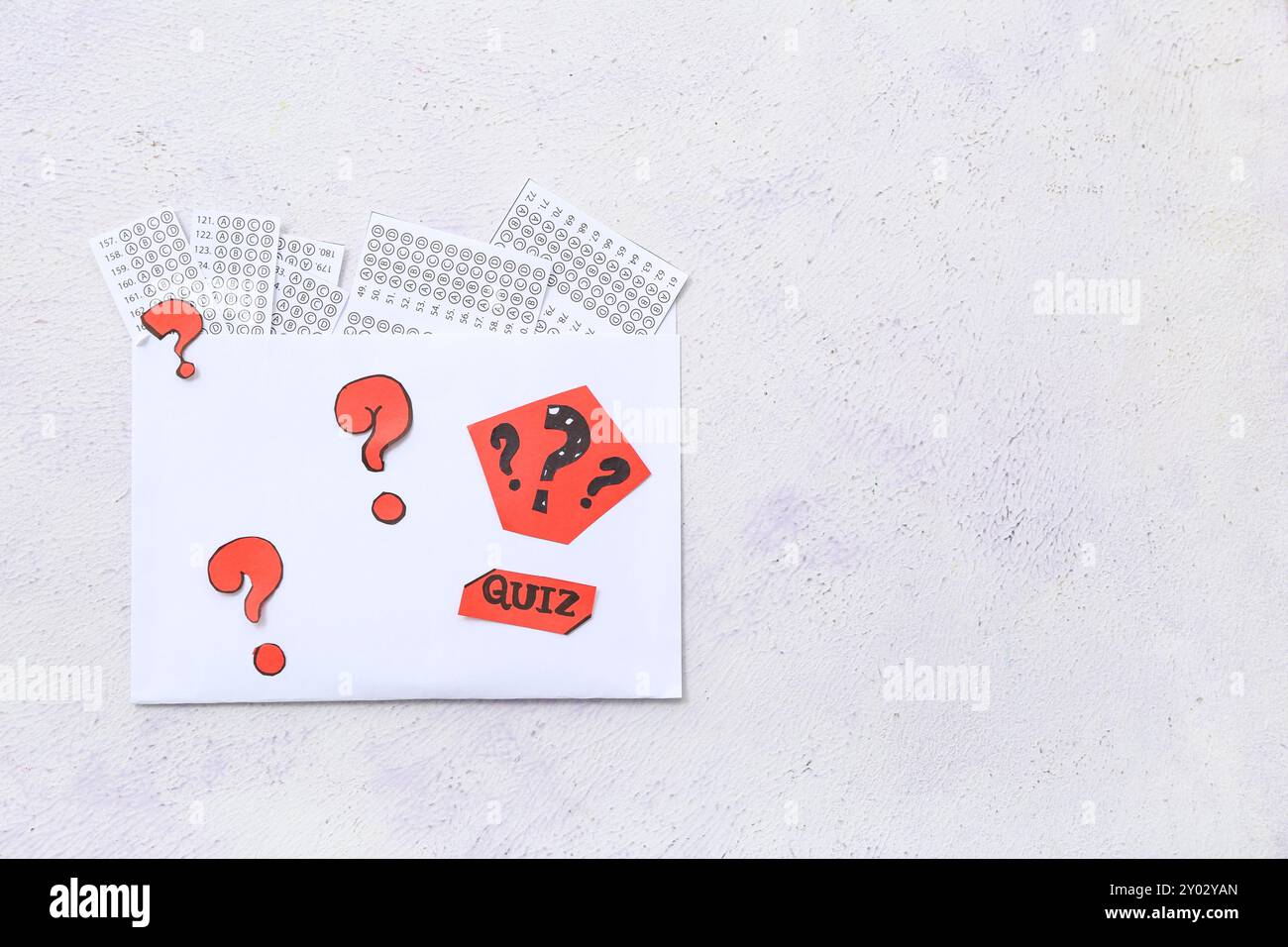 Envelope with quiz forms and question marks on white background Stock ...