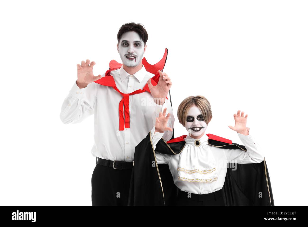 Little boy with his father dressed for Halloween as vampires on white ...
