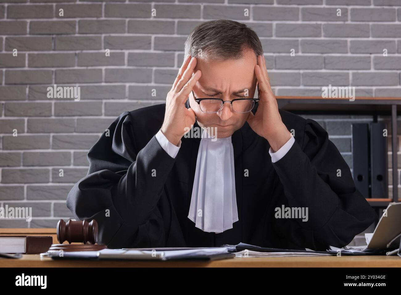 Mature male judge sitting hi-res stock photography and images - Alamy