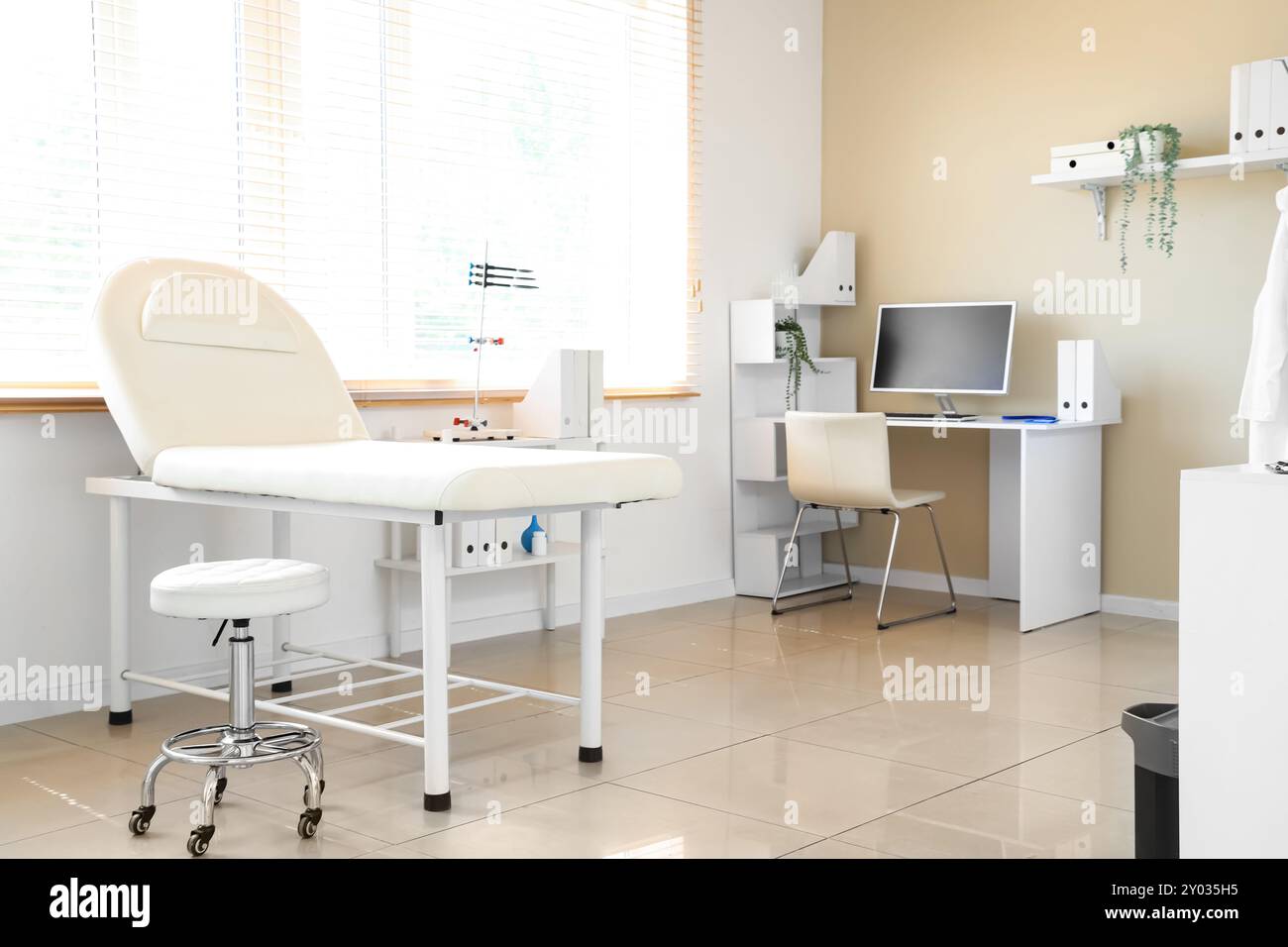 Light interior of doctor's office with modern workplace and couch Stock ...