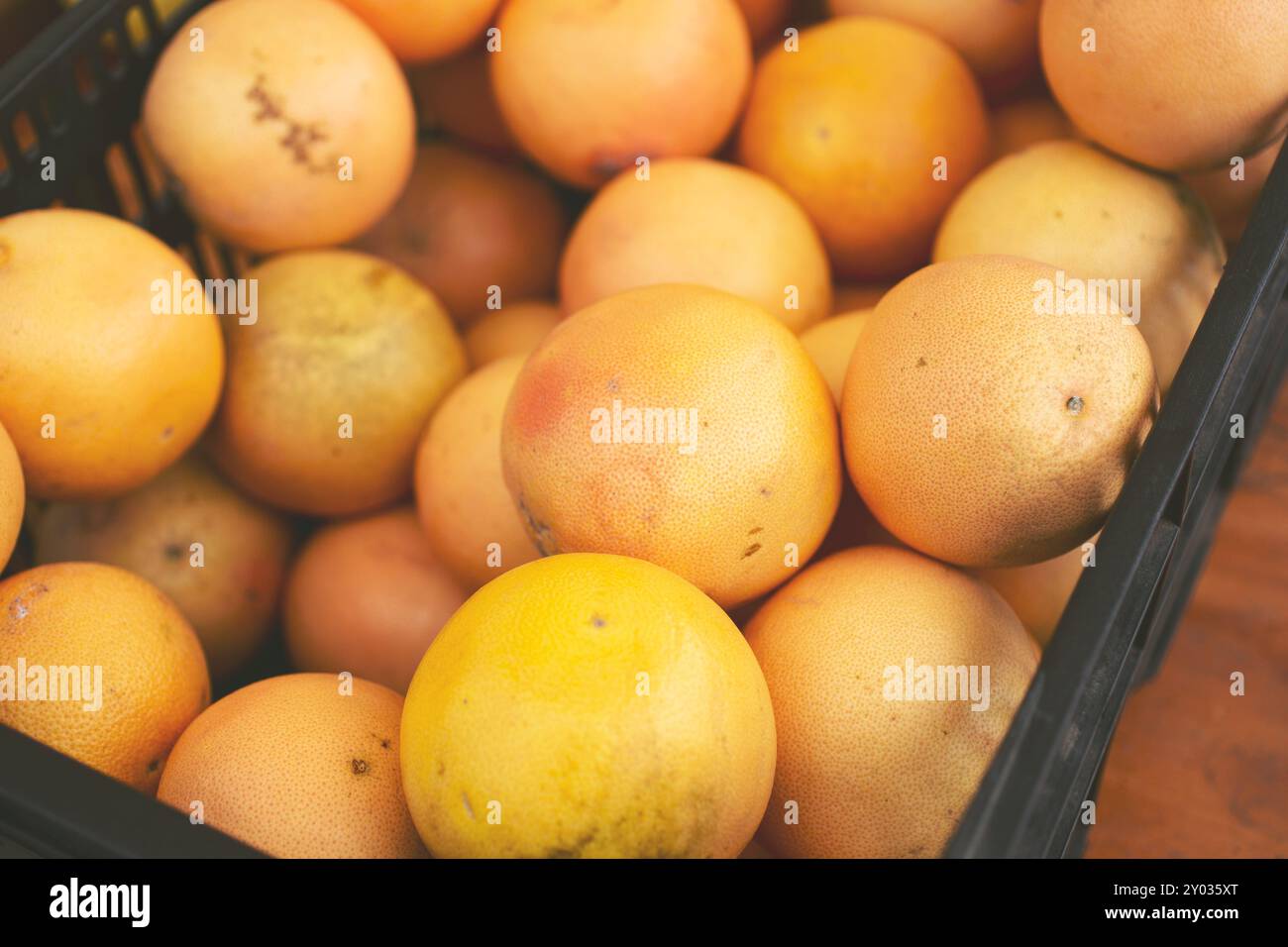 A view of a crate full of grapefruit, seen at a local farmers market ...