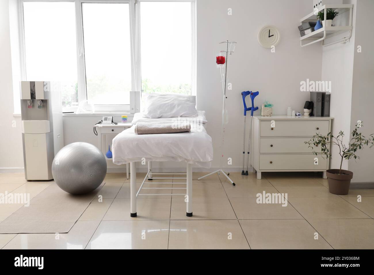 Interior of hospital ward with bed, drawers and cooler Stock Photo - Alamy