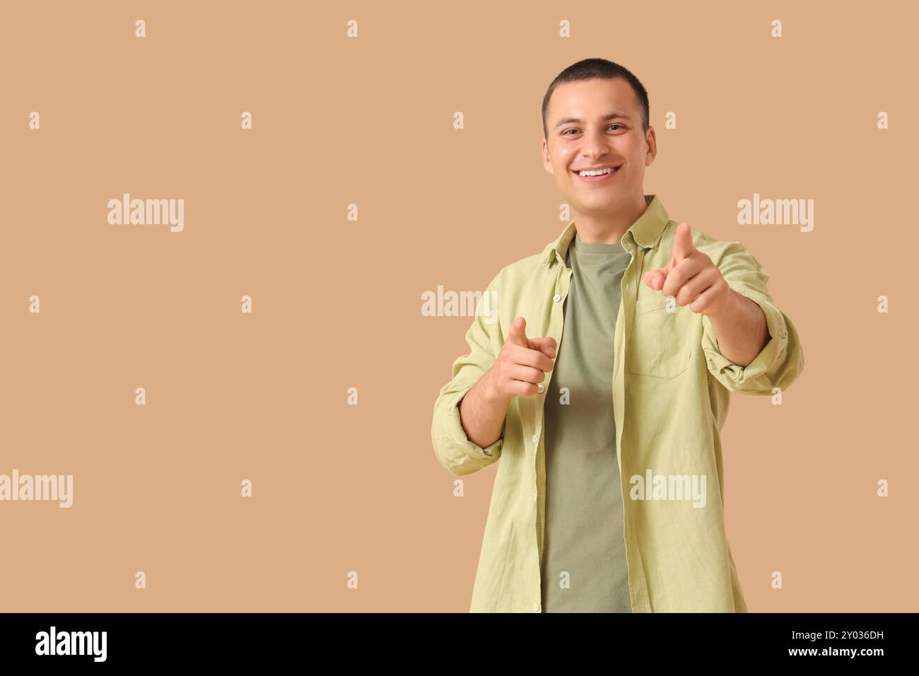 Happy man pointing viewer hi-res stock photography and images - Alamy