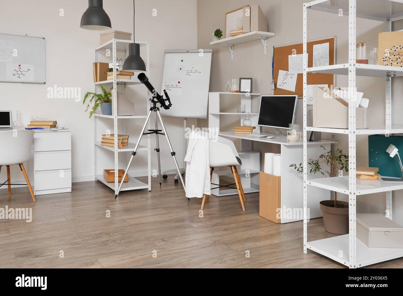 Interior of medical laboratory with computer, telescope and scientific ...
