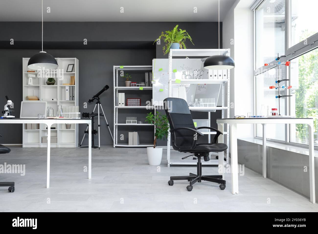 Interior of laboratory with desks and shelf units Stock Photo - Alamy