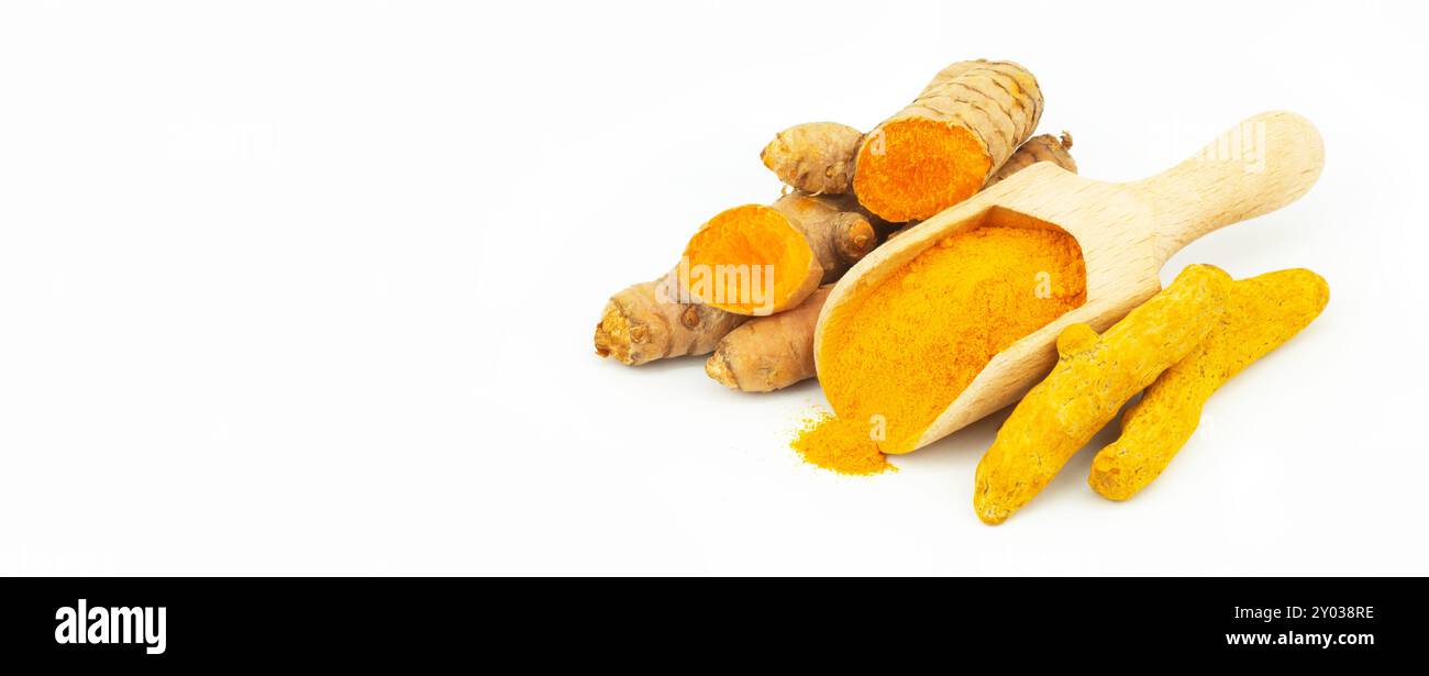 Turmeric powder in spoon and turmeric root isolated on white background ...