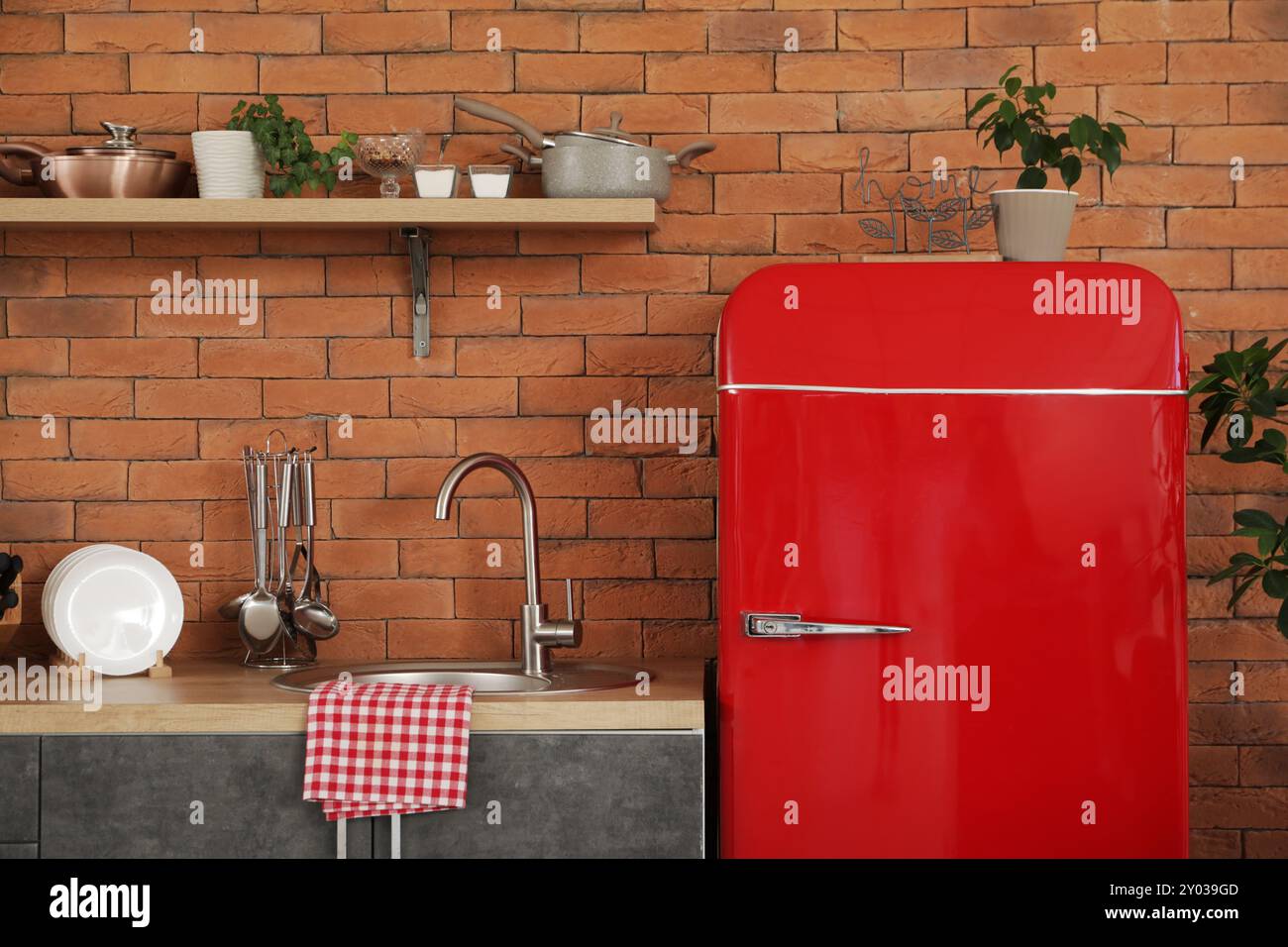 Interior of modern kitchen with red fridge, sink and shelf Stock Photo ...