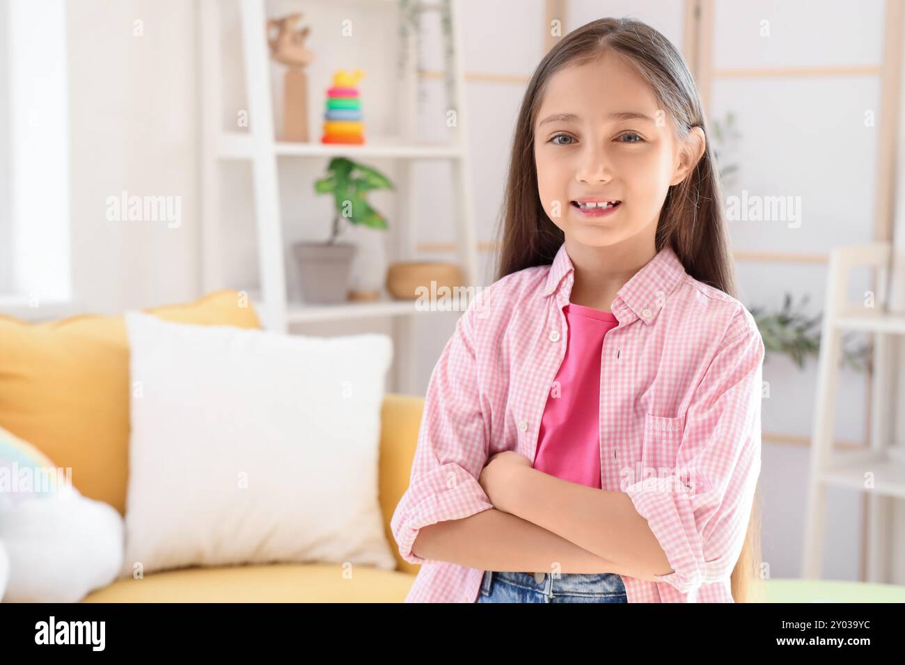 Cute little girl smiling at home Stock Photo - Alamy
