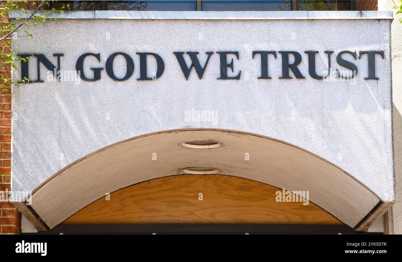 Signage on building reading "In God We Trust Stock Photo - Alamy