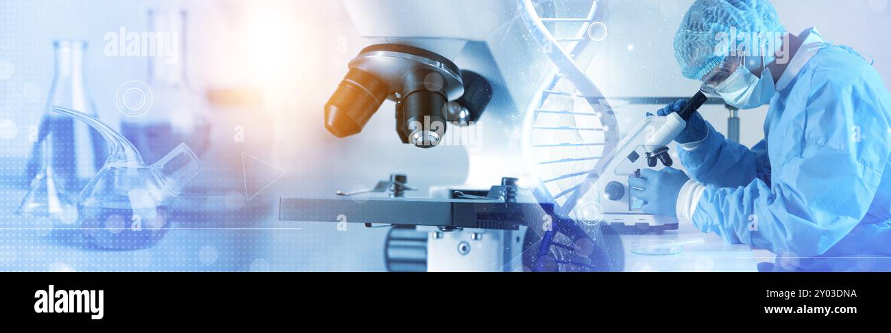Scientist using microscope in lab, glassware on table and DNA, multiple ...