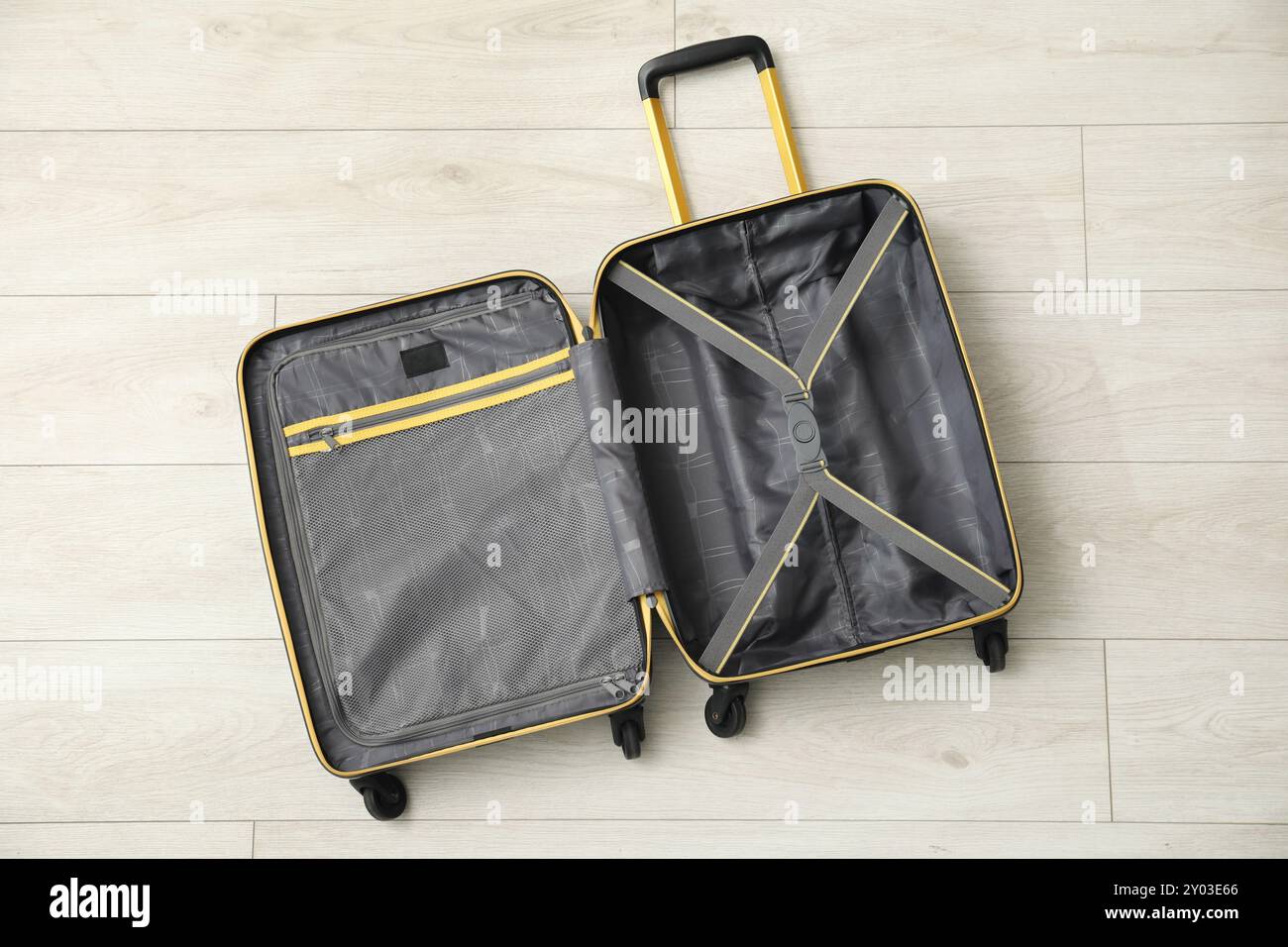 Open empty suitcase for travelling on floor indoors, top view Stock ...