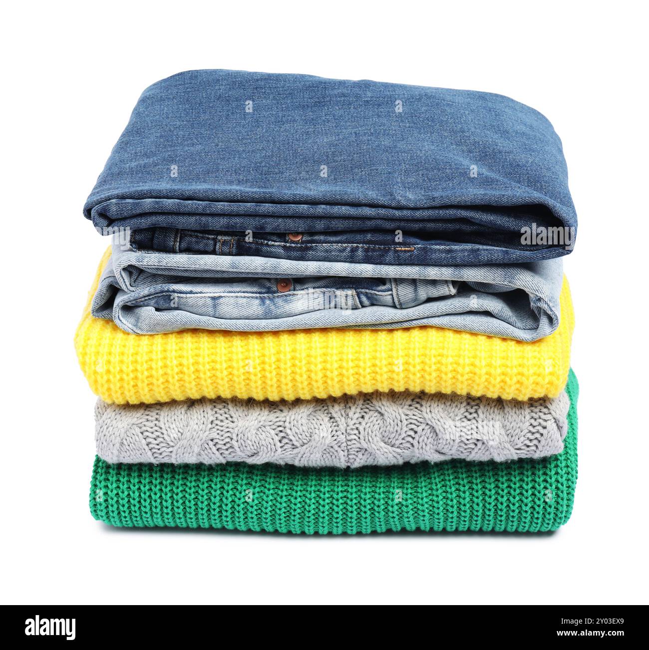 Stack of sweaters and jeans isolated on white Stock Photo - Alamy