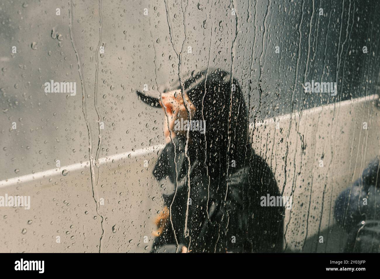 Rain on window in front of person on a boat Stock Photo - Alamy