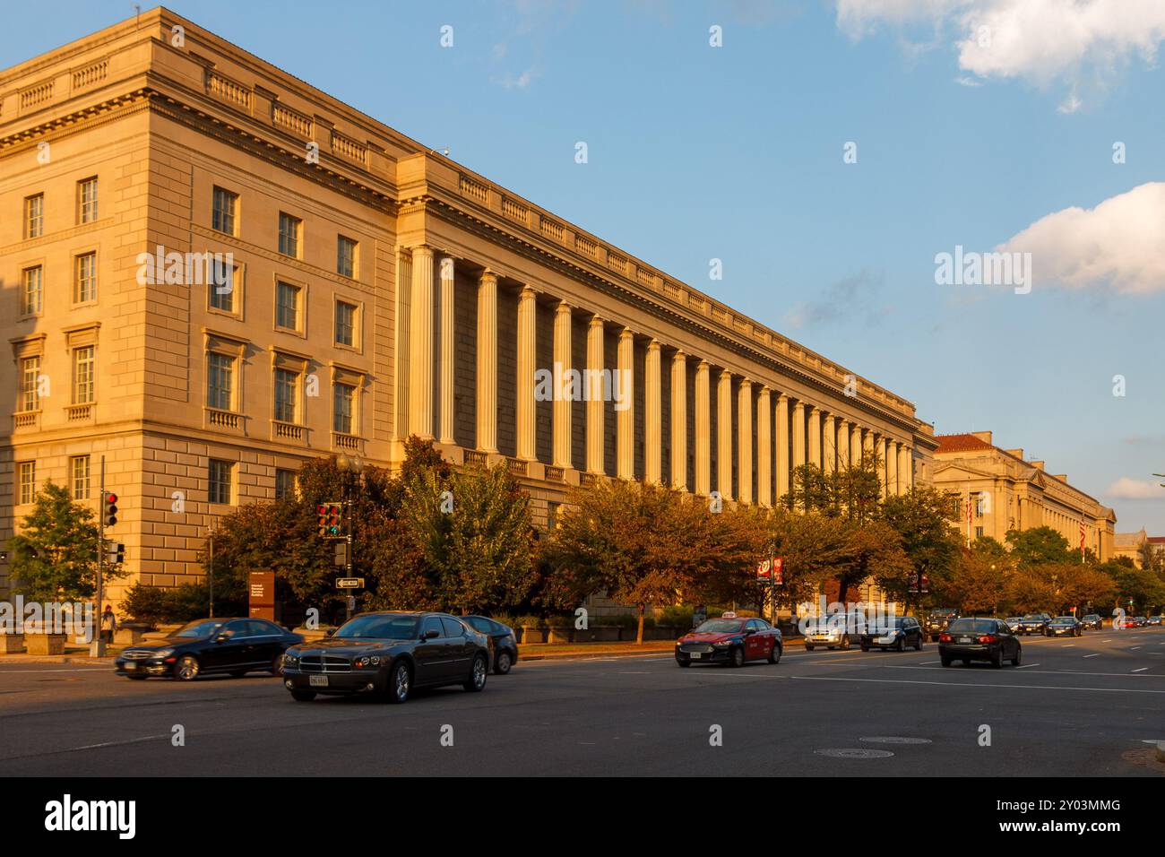 The facade of the William Jefferson Clinton West Building at sunset in ...