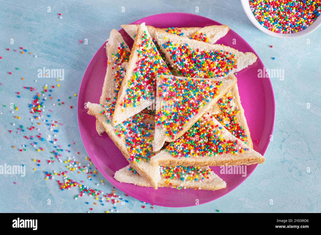 Slices of fairy bread on a plate. Fairy bread is a traditional Australian party food Stock Photo ...
