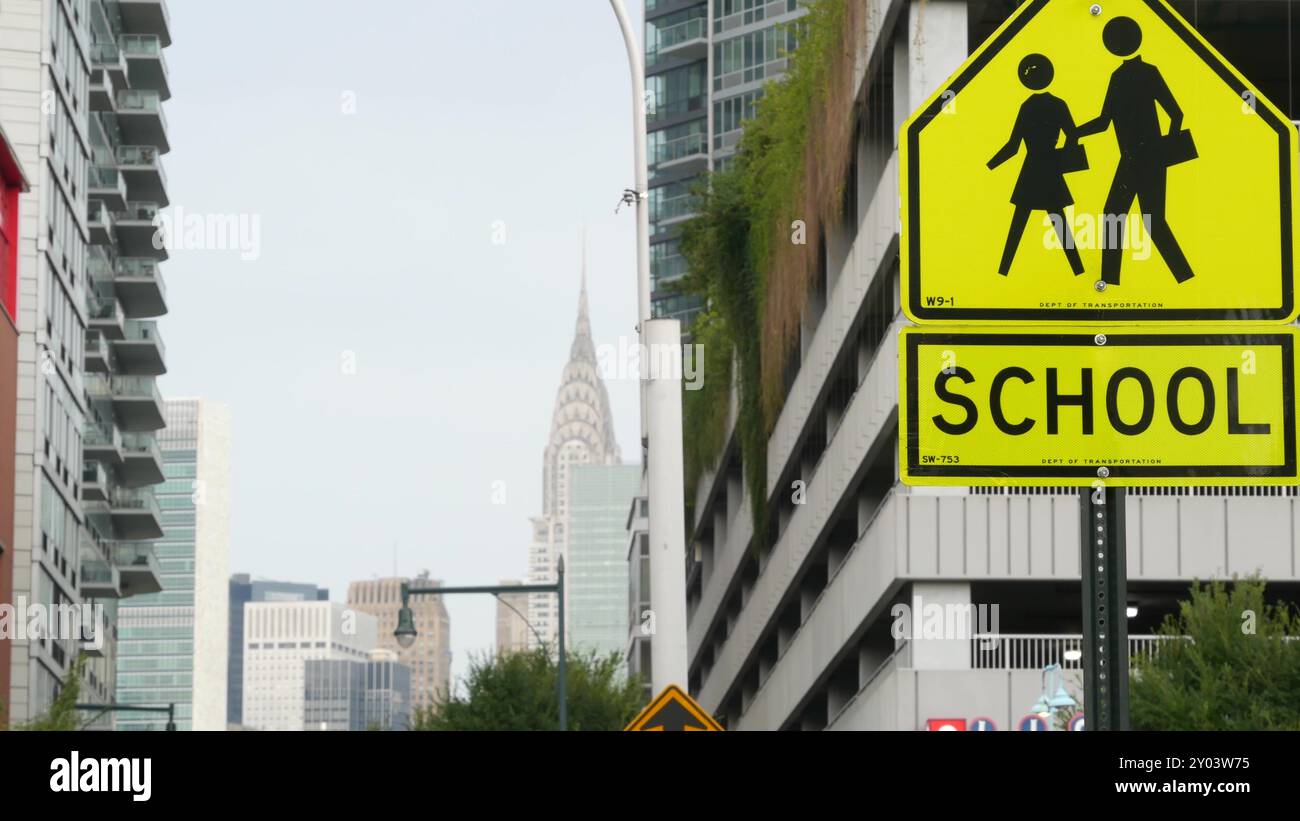 School zone yellow road sign, pedestrian crossing. Children safety, New York City street ...