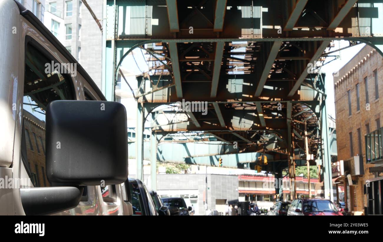 Elevated subway above New York city street. Metropolitan bridge over ...