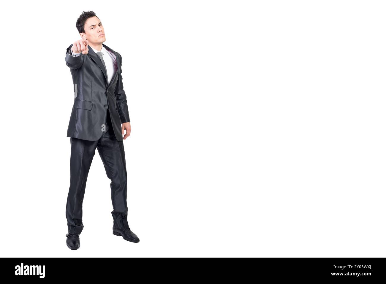 Serious man pointing to camera. White background Stock Photo - Alamy