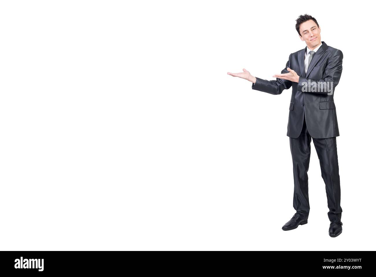 Optimistic man in suit pointing aside. White background Stock Photo - Alamy