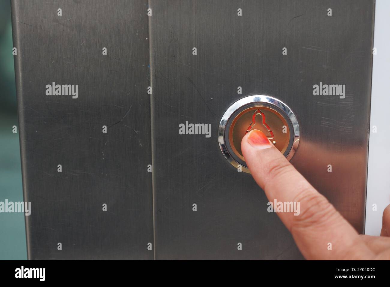 The man push lift button down Stock Photo - Alamy