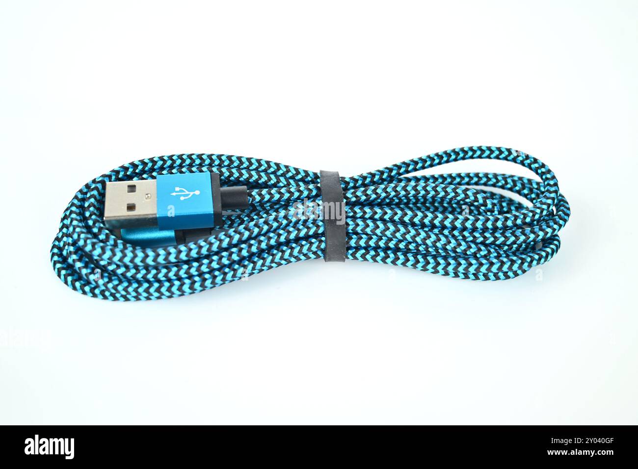 USB charging cable in blue and black braid – Wales, UK – 30 August 2024 ...