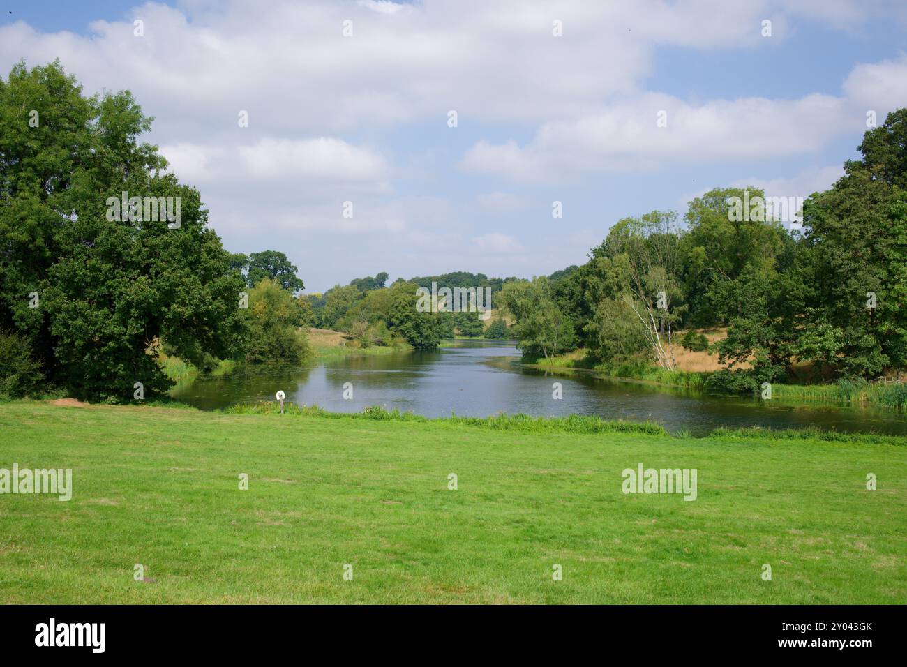 UK country landscape with lake and trees Stock Photo - Alamy