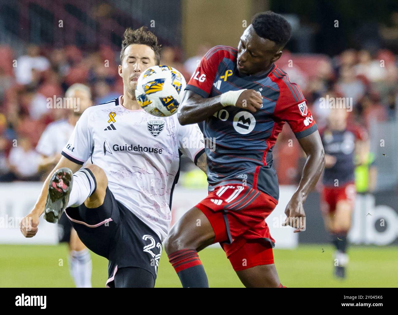 Toronto, Canada. 31st Aug, 2024. Aaron Herrera (L) of D.C. United vies ...