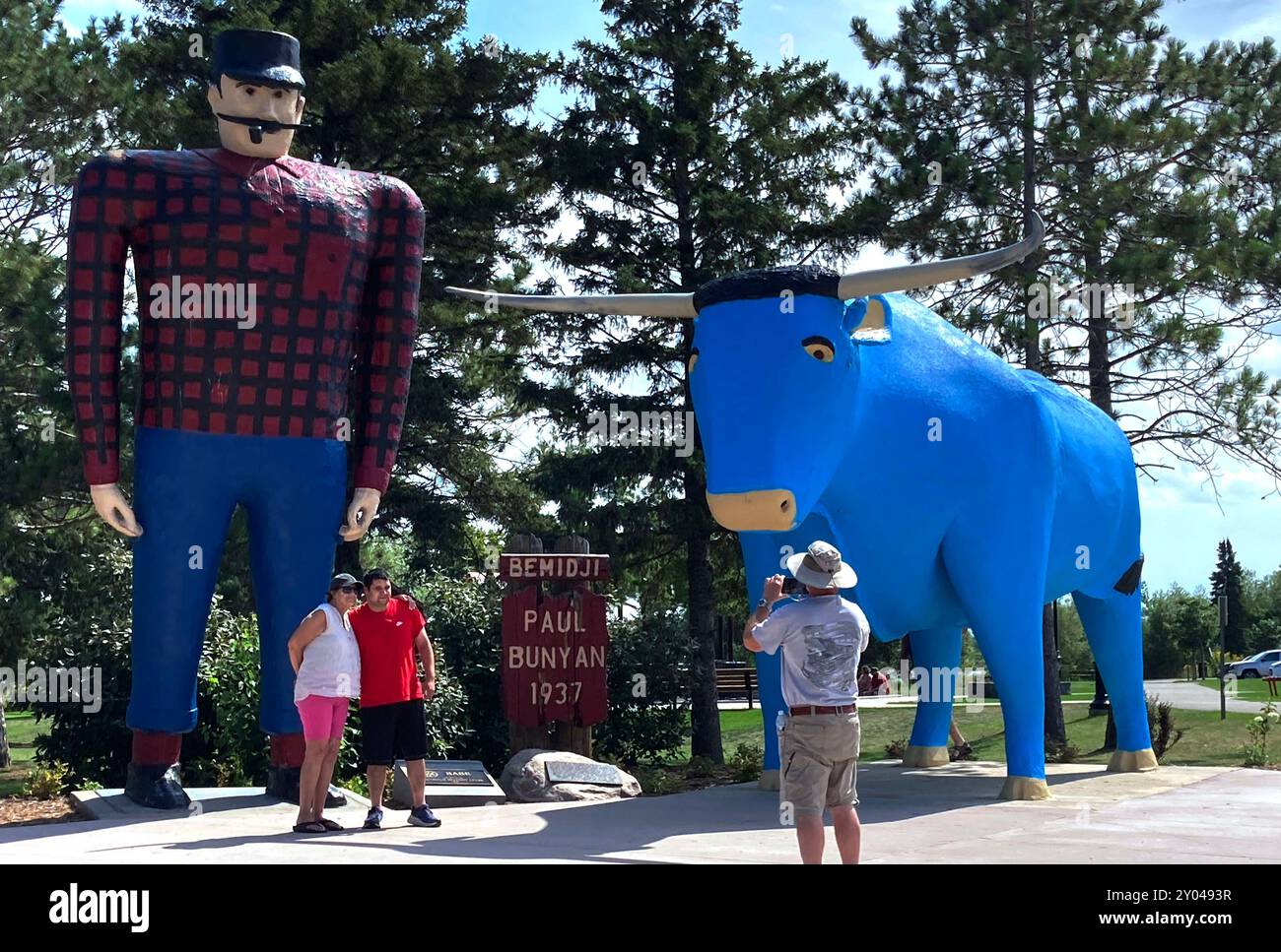 Bemidji, United States. 26th Aug, 2024. People pose by the statues of ...