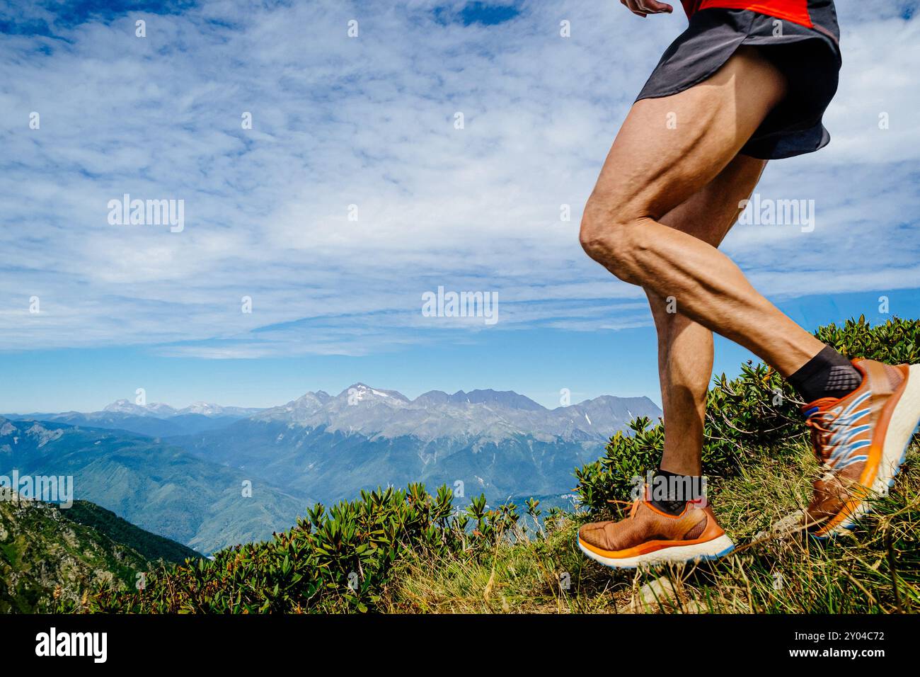 legs runner on steep slope run marathon race in background mountains ...