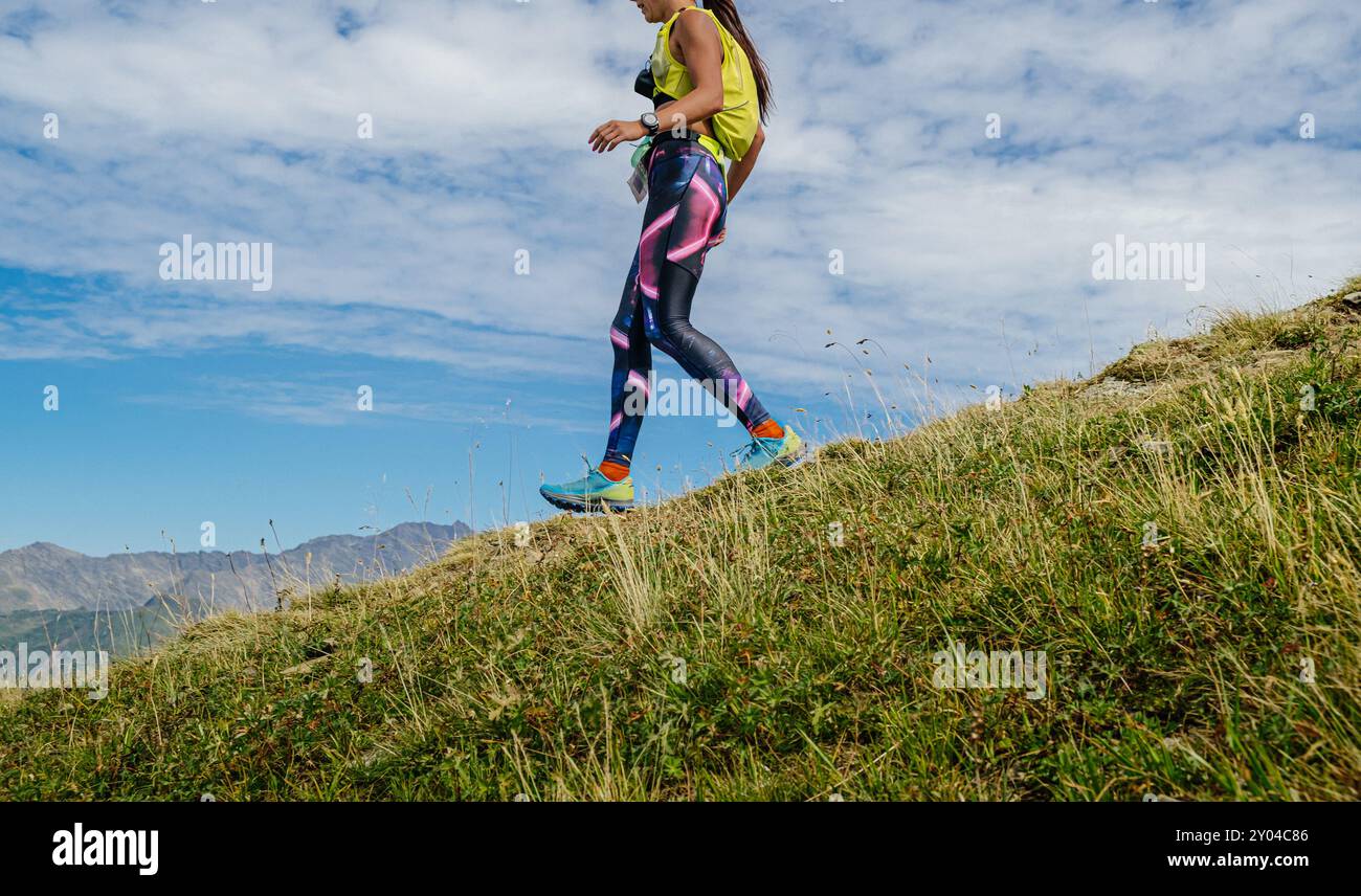 woman runner running on steep slope mountain marathon race Stock Photo ...
