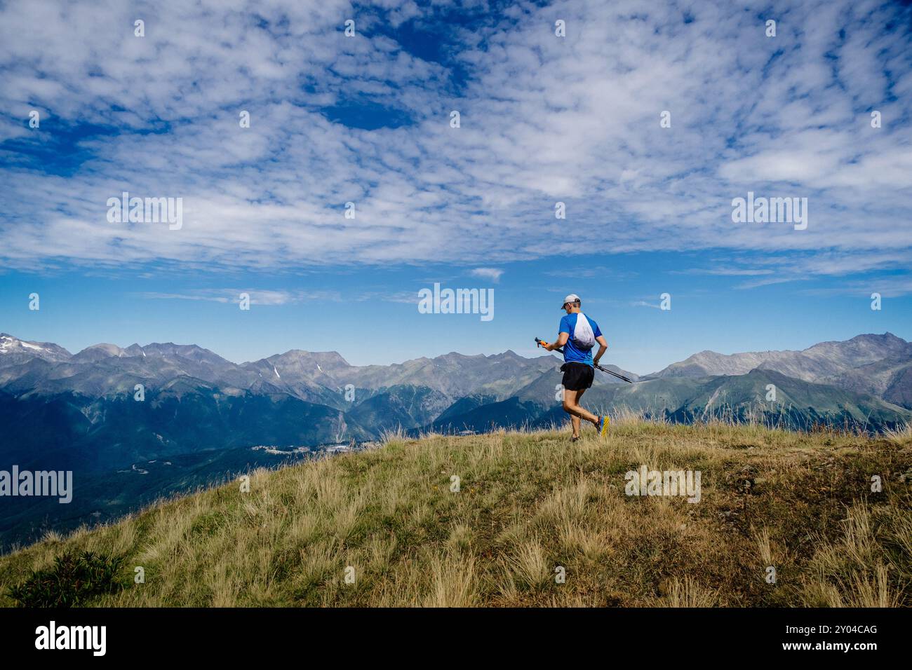 Man runner trekking poles hi-res stock photography and images - Alamy