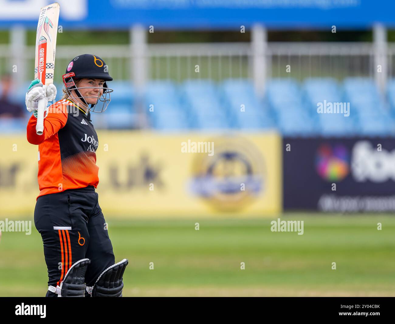 Tammy Beaumont raises her bat as she reaches 50 for The Blaze in a ...