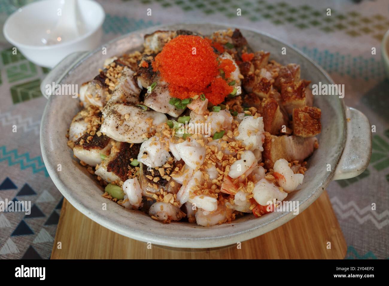 Rice bowl dish featuring a delicious combination of tender seafood ...
